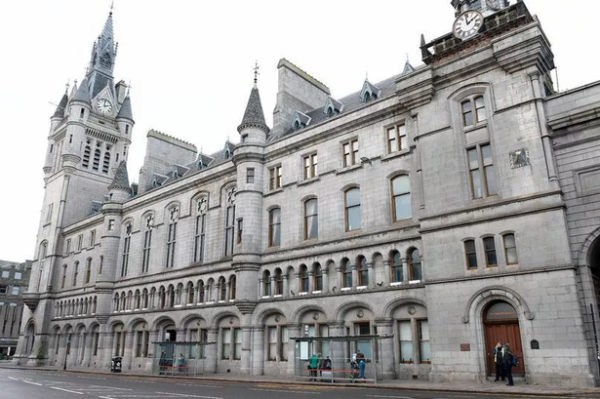 Two people appear in court charged over Aberdeen murder bid